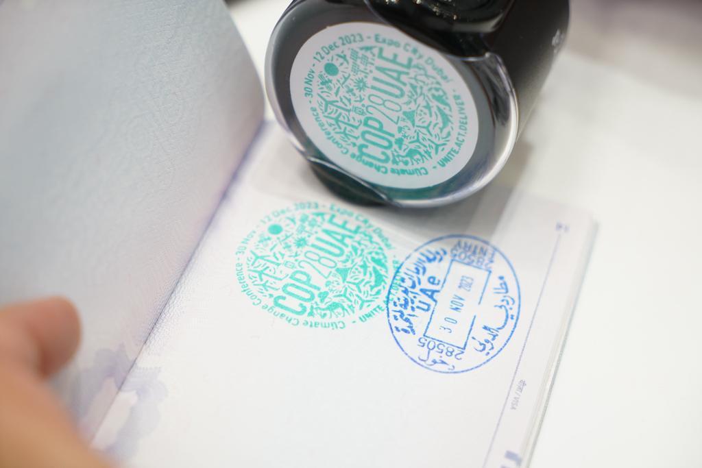 GDRFA Unveils Special COP28 Stamp at Dubai Airports